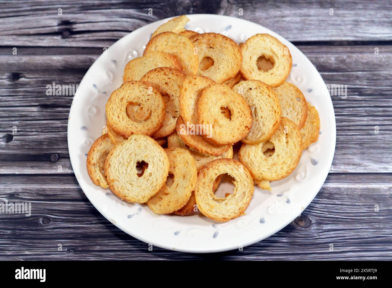 a rich toasted snack made of wheat that is baked not fried, wheat ...