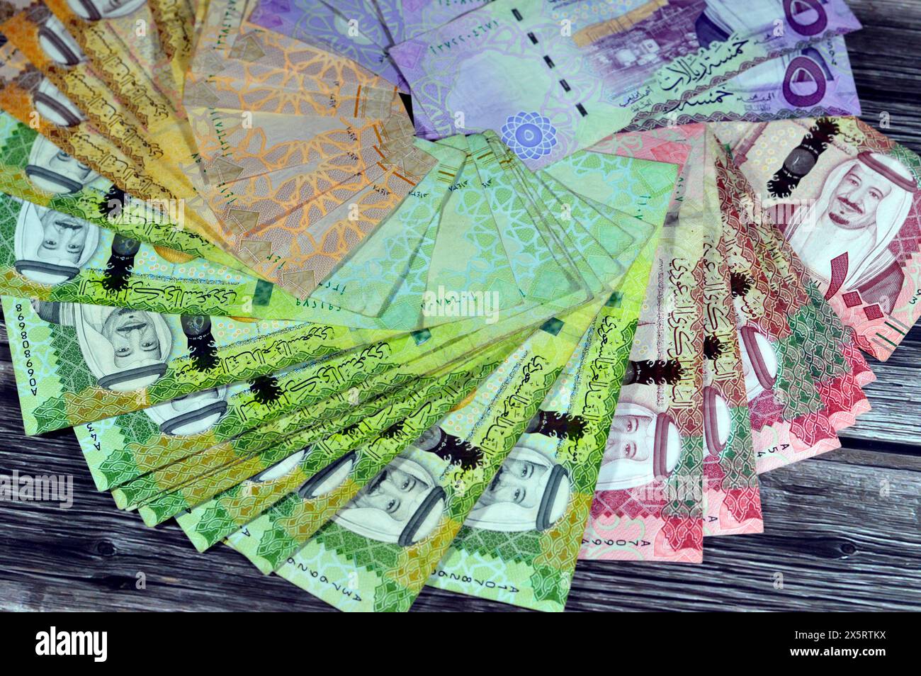 Background of Saudi Arabia money banknotes bill of different values ...