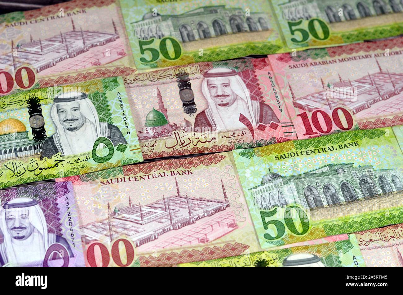 Background of Saudi Arabia money banknotes bill of different values ...