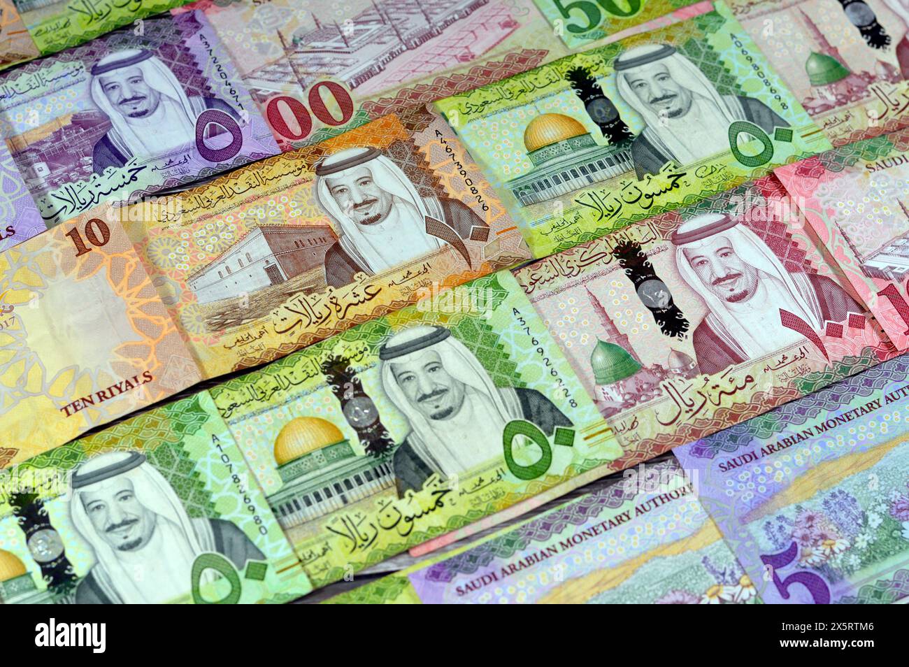 Background of Saudi Arabia money banknotes bill of different values ...