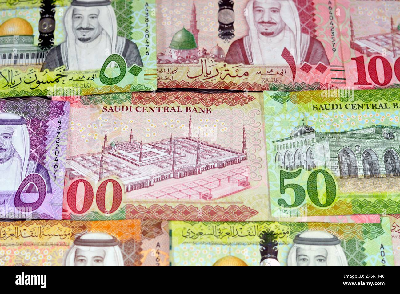 Background of Saudi Arabia money banknotes bill of different values ...
