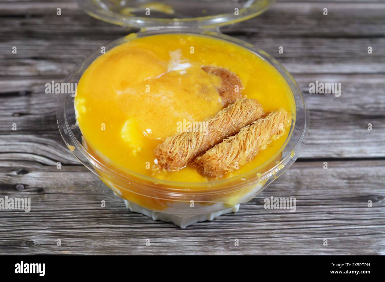 A sweet mixture dessert of rice pudding, milk cream qishta, basbousa ...