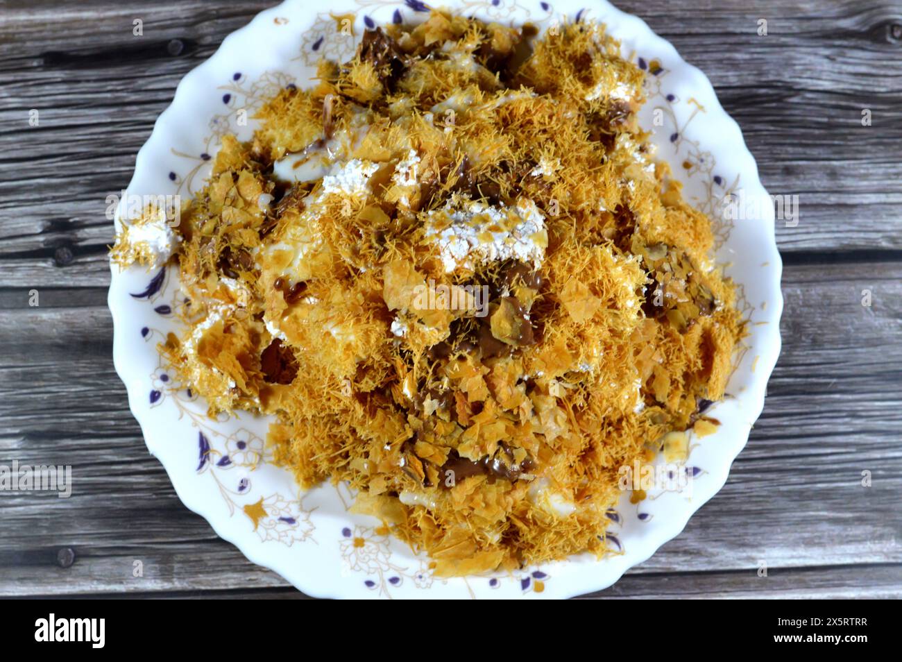 chocolate paste sauce on top of Sweet Koshary recipe in Egypt made of ...