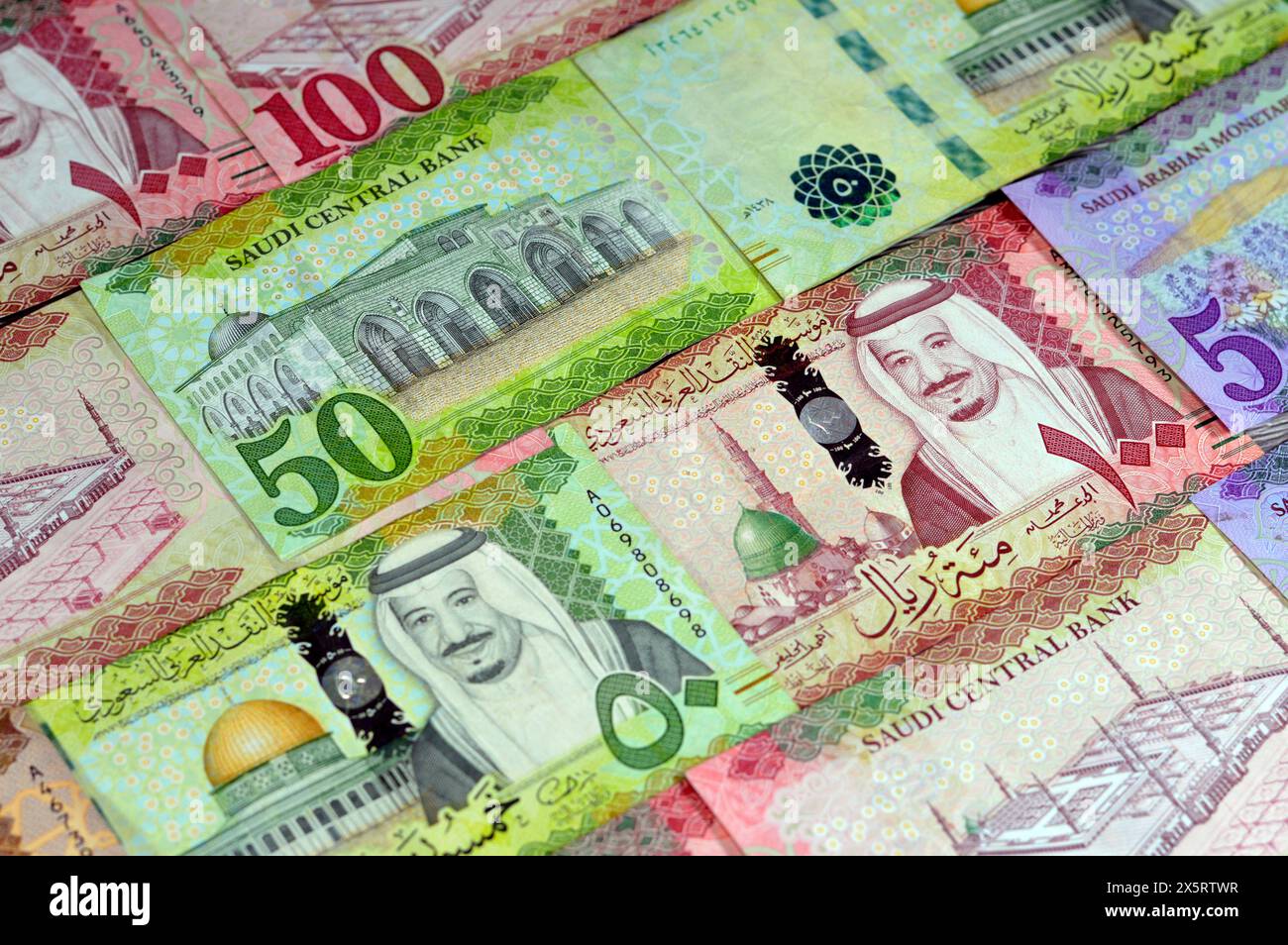Background of Saudi Arabia money banknotes bill of different values ...