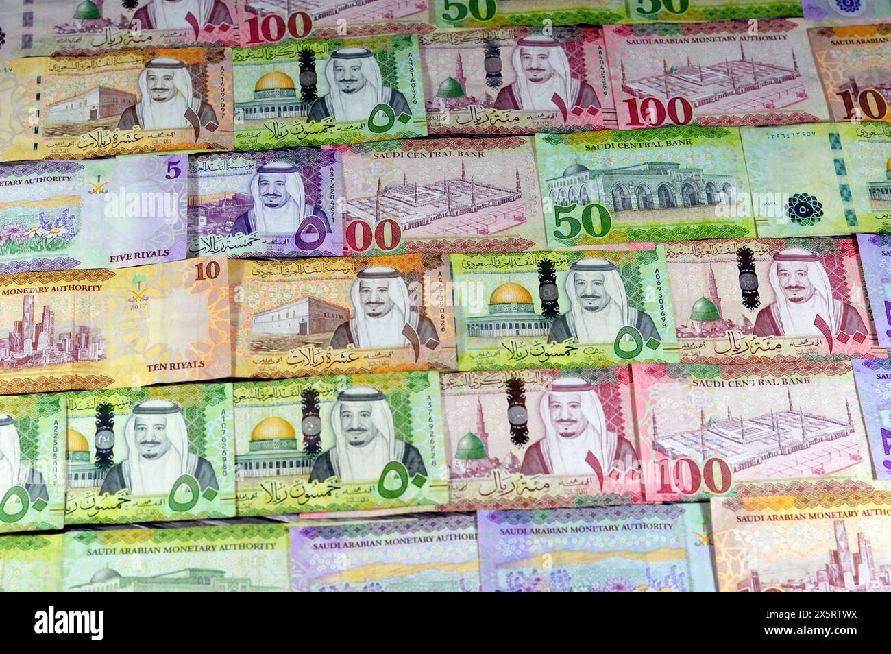 Background of Saudi Arabia money banknotes bill of different values ...