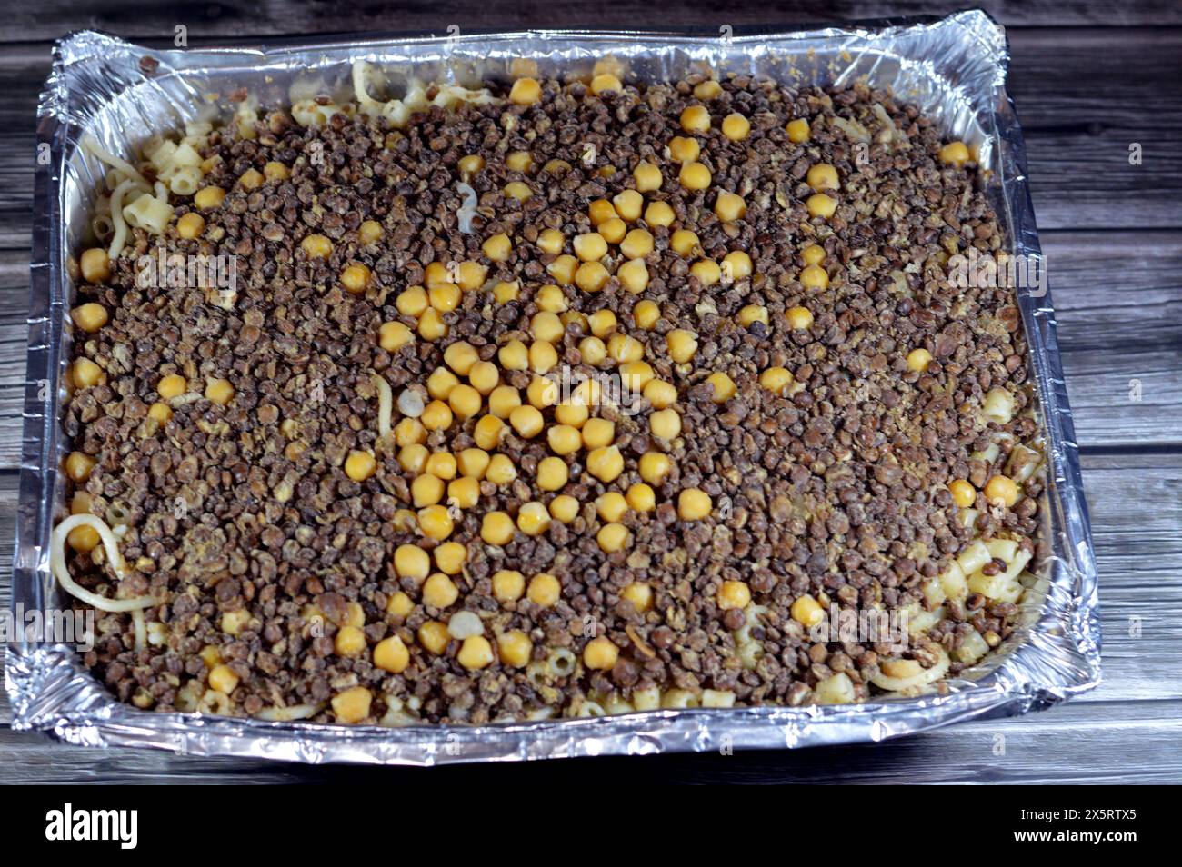 Egyptian cuisine of Koshary, a popular street food made of rice ...