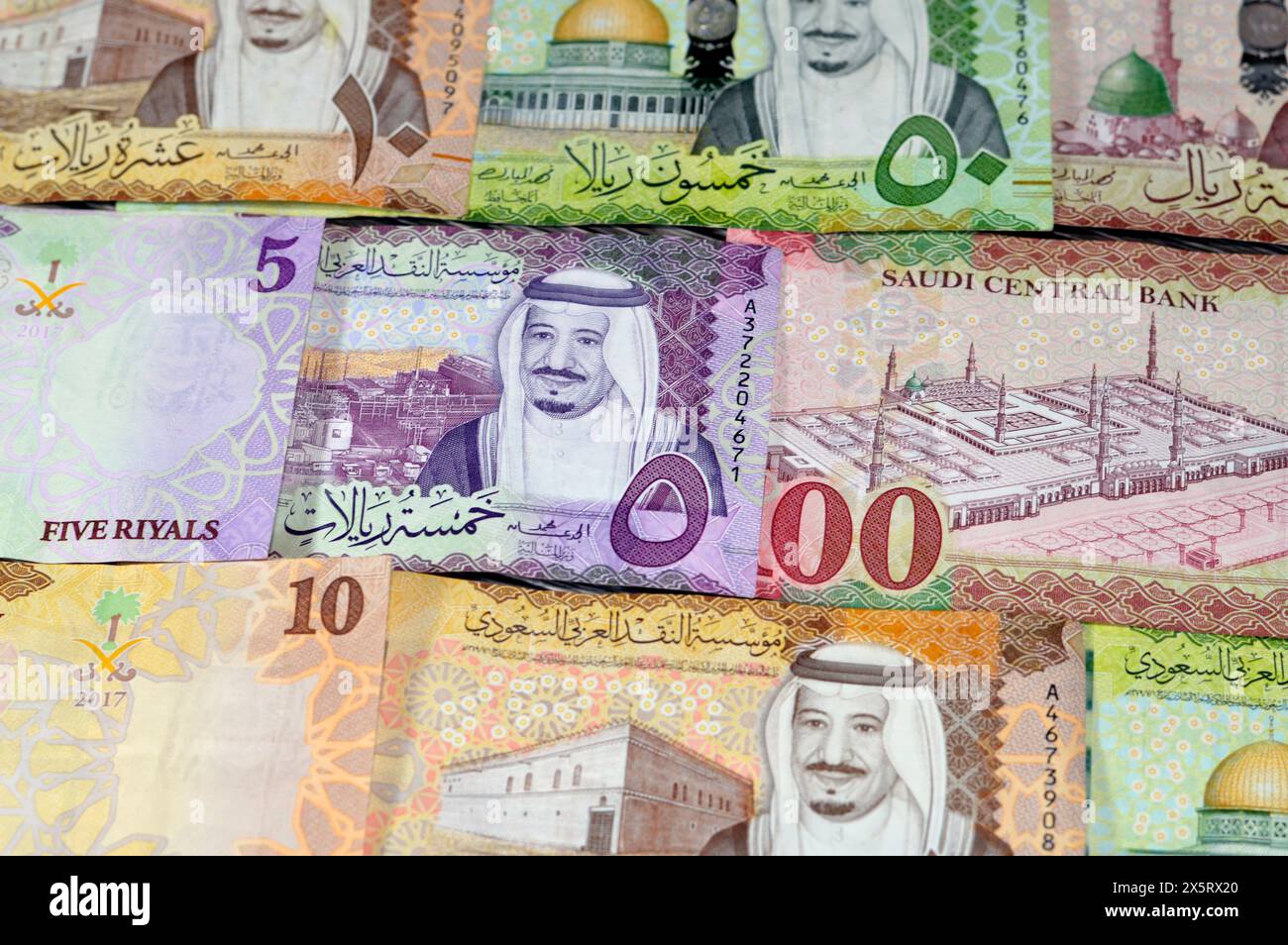 Background of Saudi Arabia money banknotes bill of different values ...