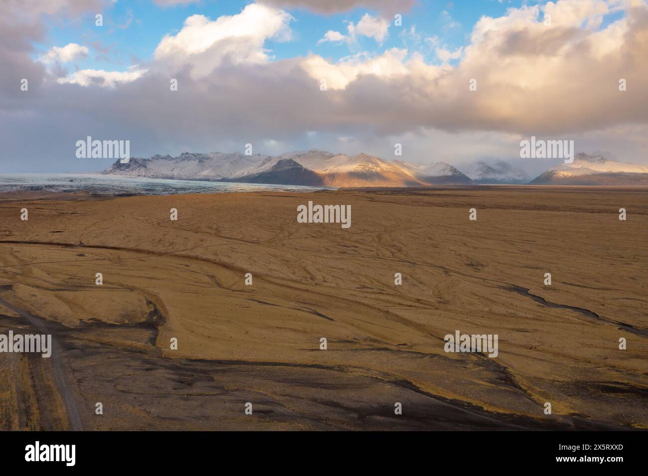 Aerial view of volcanic lava valley covered ash and sand. Mountains ...
