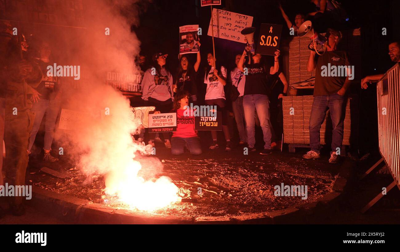 TEL AVIV, ISRAEL - MAY 9: Protestors chant slogans as they let off red ...