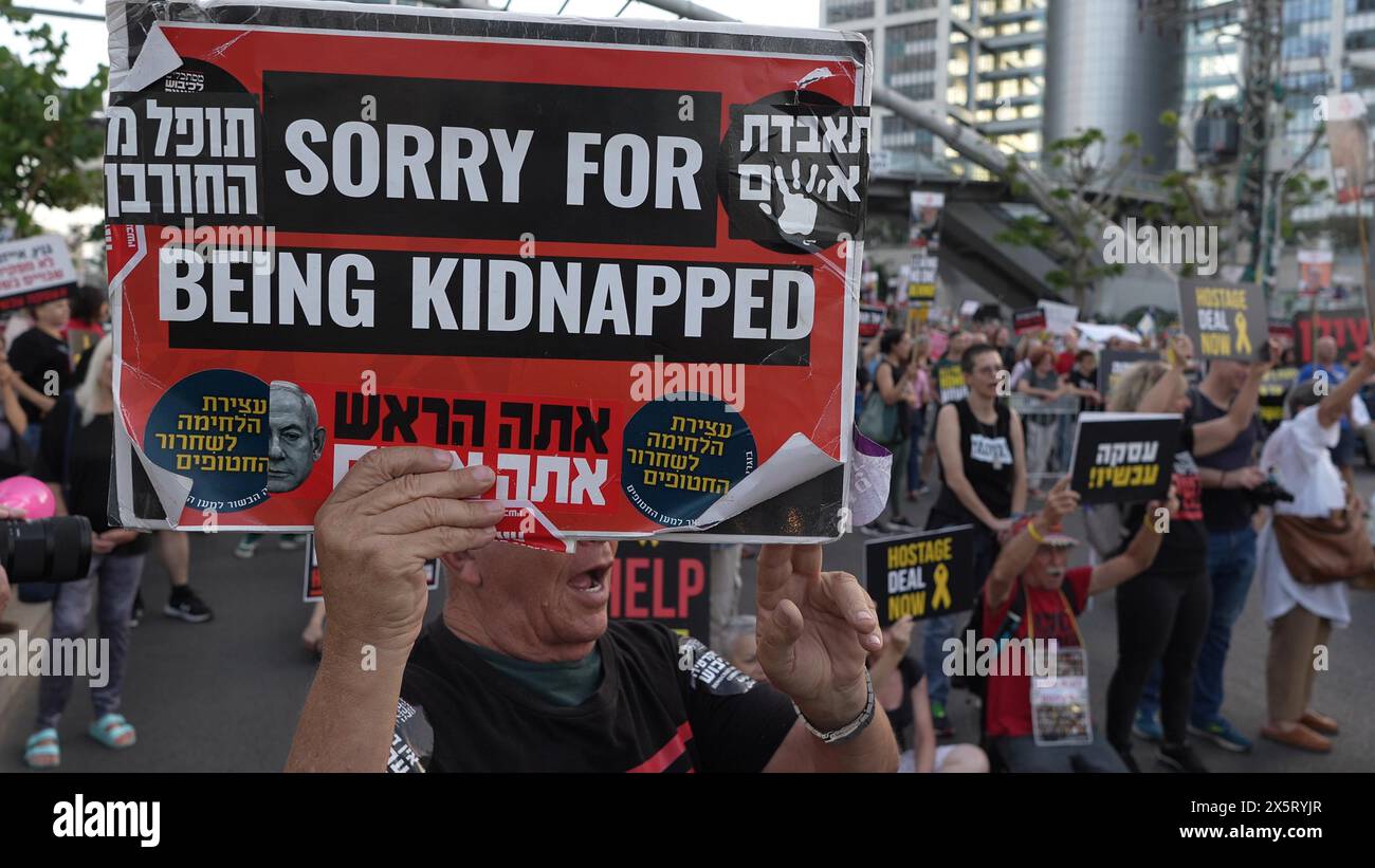 TEL AVIV, ISRAEL - MAY 9: A protestor holds a sign that reads "Sorry ...