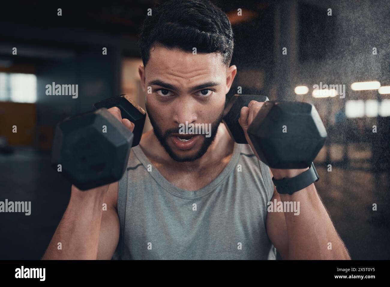 Bodybuilder, portrait of man and dumbbell in gym for muscle growth, fitness challenge or ...
