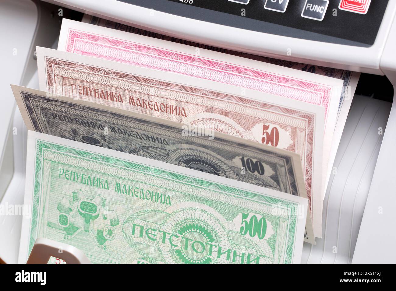 Old Macedonian money - denar in a counting machine Stock Photo - Alamy