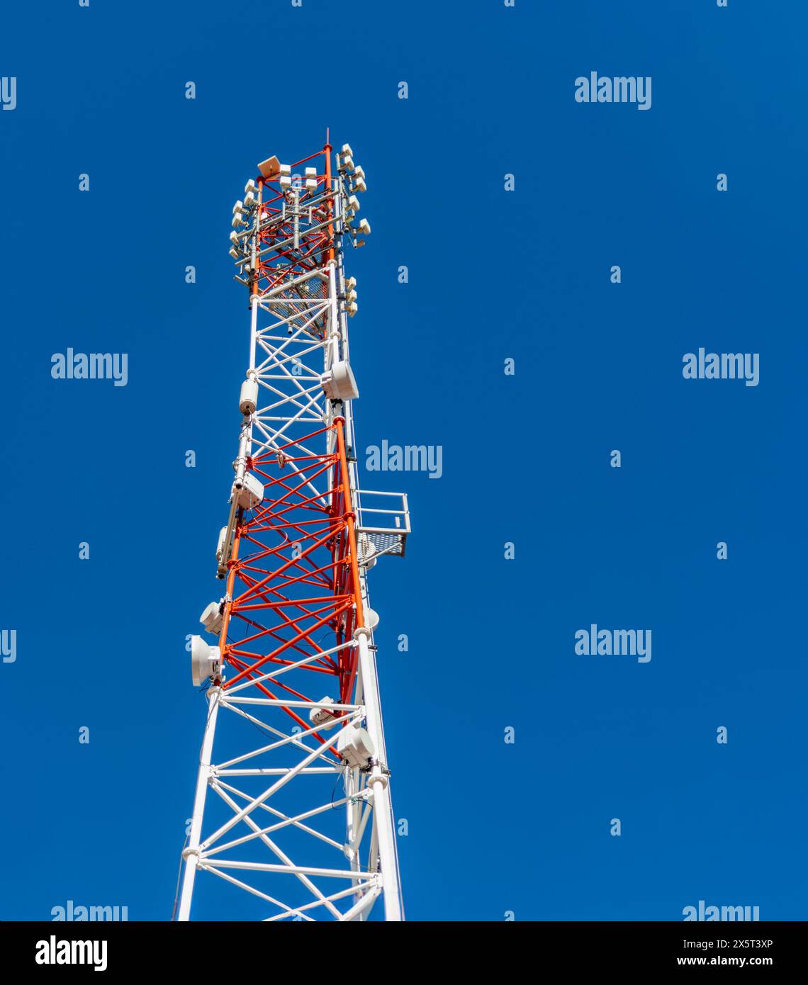 cellular communications tower against the blue simple sky Stock Photo ...