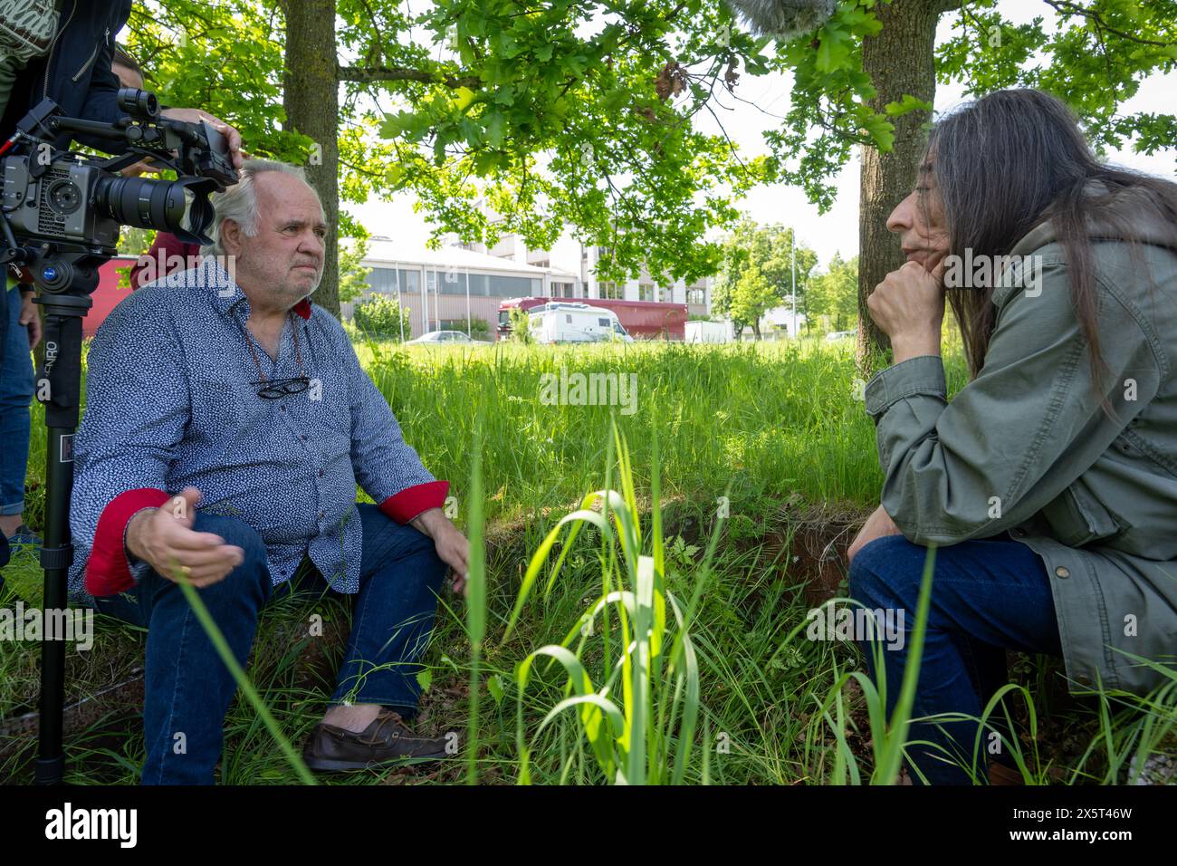 Dachau, Germany. 11th May, 2024. Filmmaker Walter Steffen (l) sits with ...