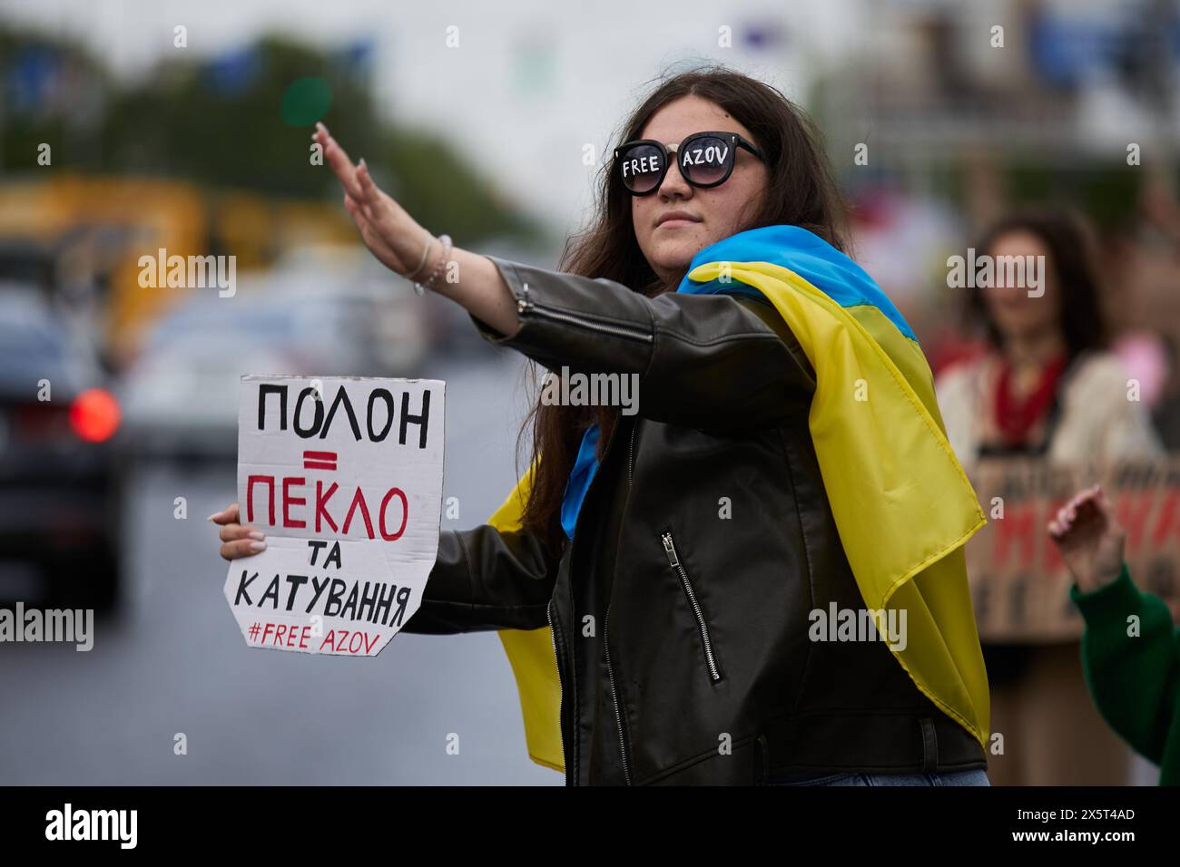 Ukrainian woman waving for the drivers to honk in support of captured ...