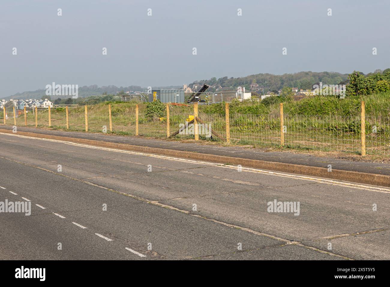 The new wooden fence posts along the Princes Parade, Hythe, Kent Stock ...