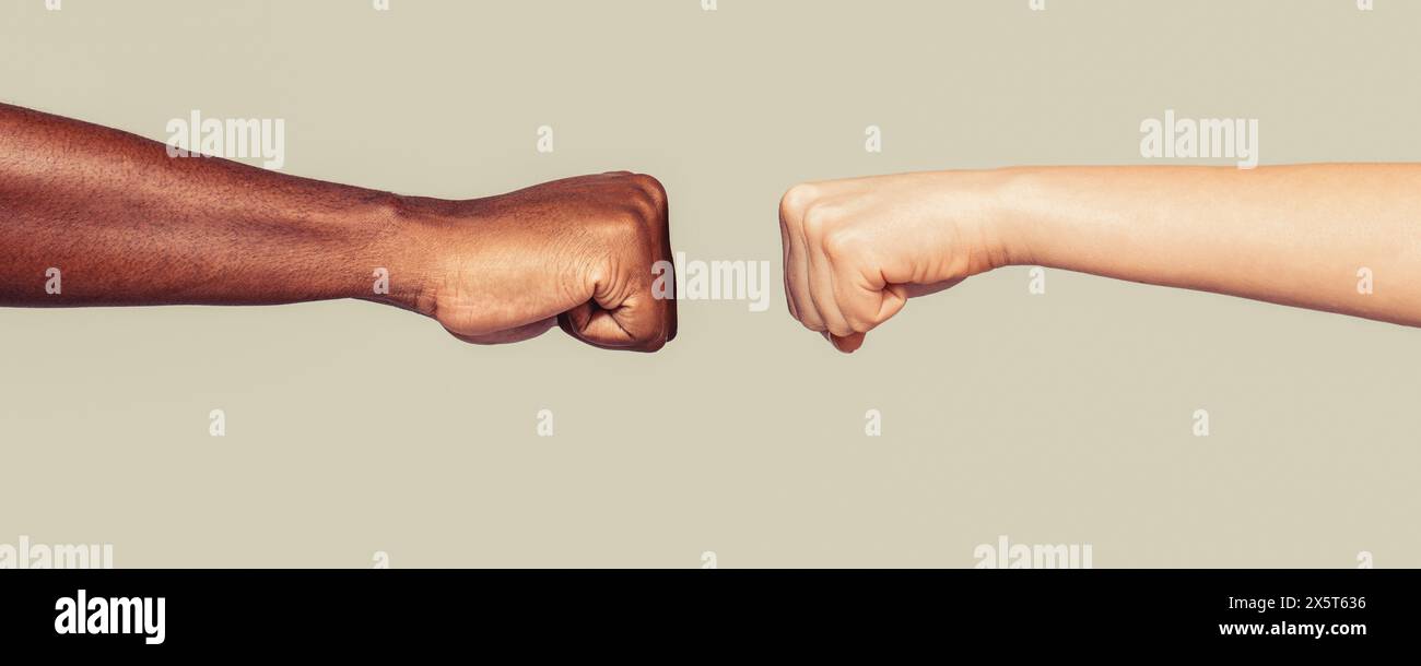 Closeup friends giving fist bump to each other. Black african american ...