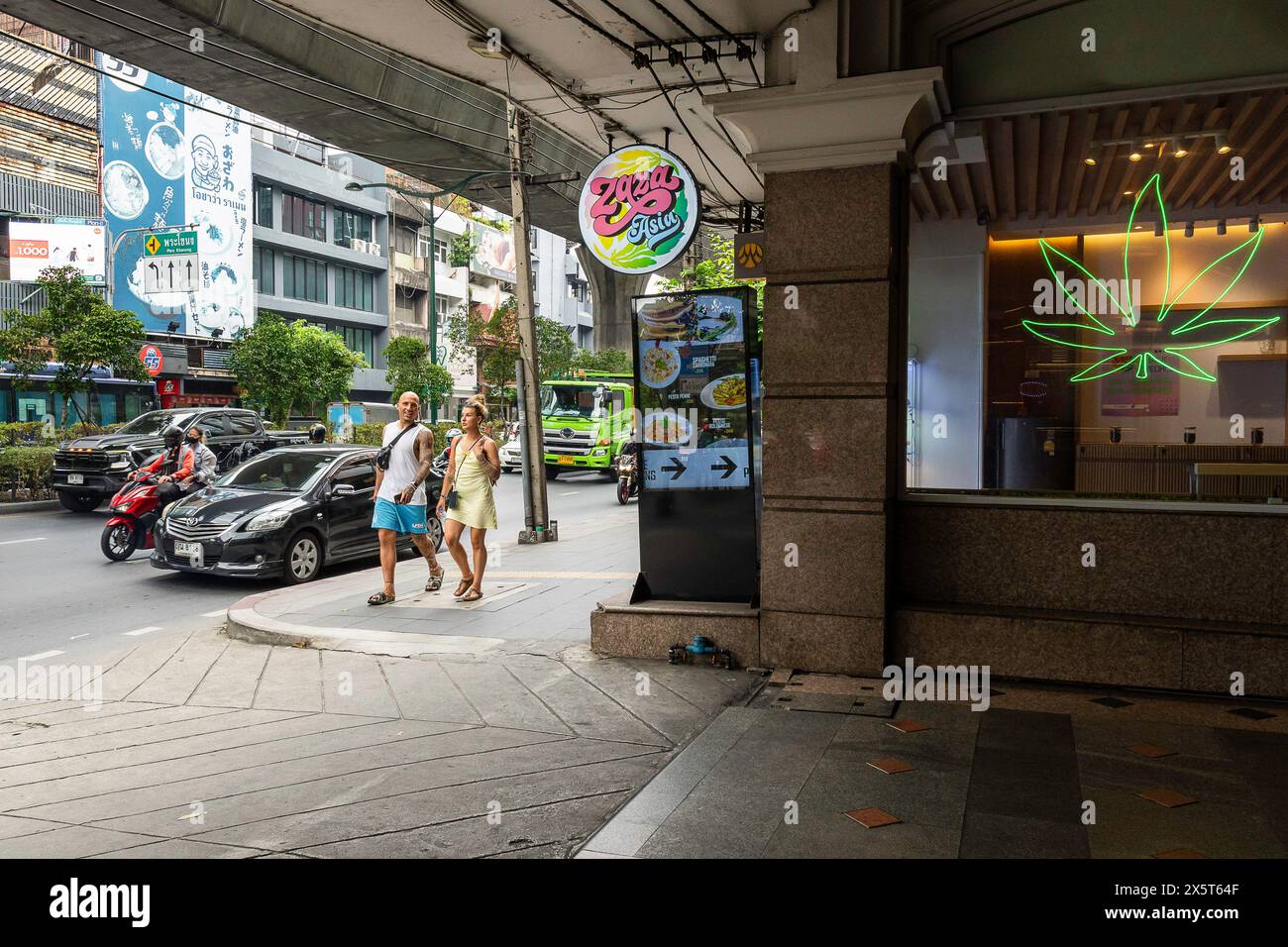 Bangkok, Thailand. 10th May, 2024. Tourists are seen passing in front of ZaZa Asia Cannabis ...
