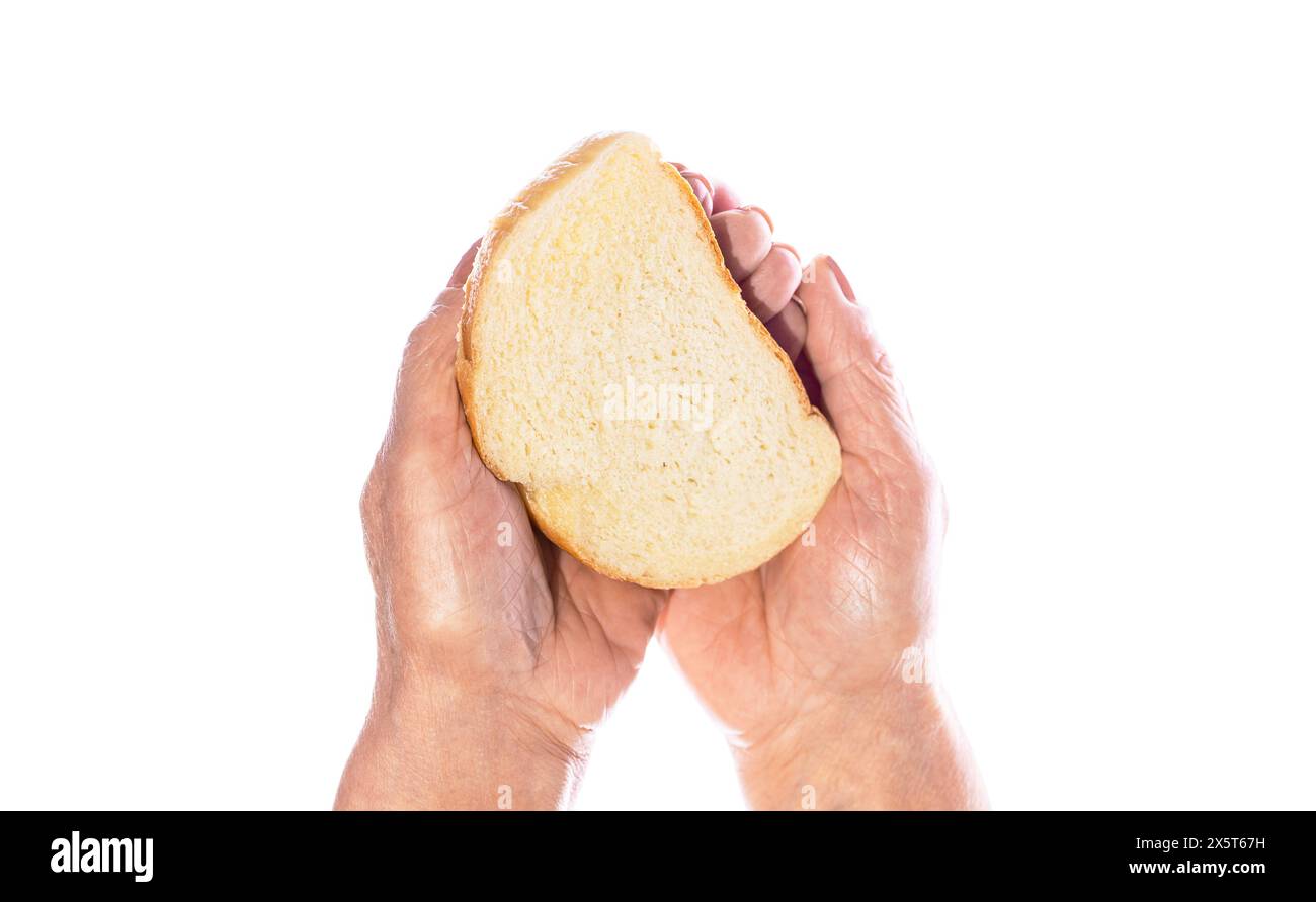 Old woman's hand holding piece of bread. Hand with slice of whole wheat ...