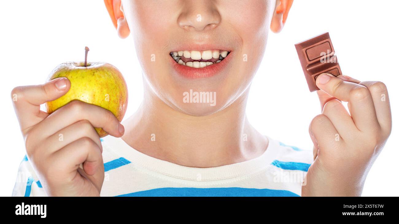 Healthy food, good teeth. Bad food bad teeth. Little boy holding an ...