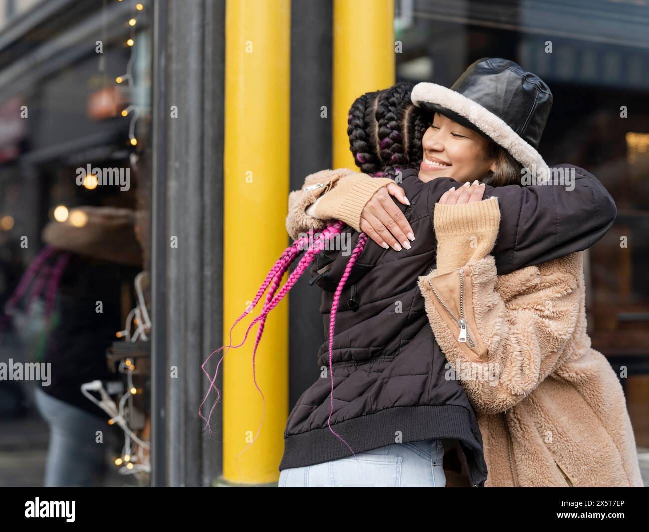 Two women hugging hi-res stock photography and images - Alamy