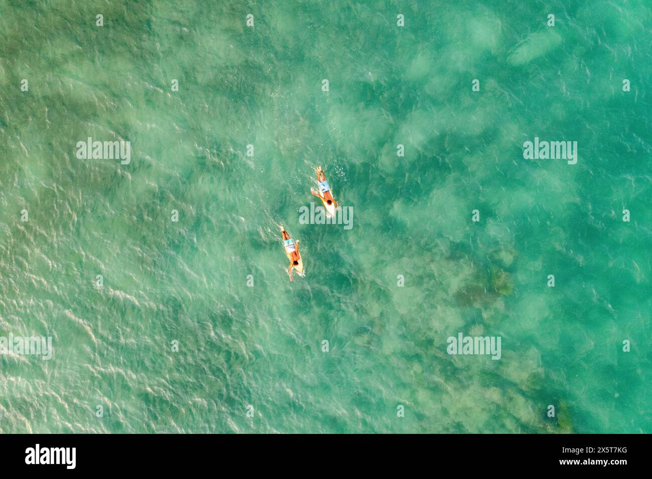 Aerial view two surfer surfboard hi-res stock photography and images ...
