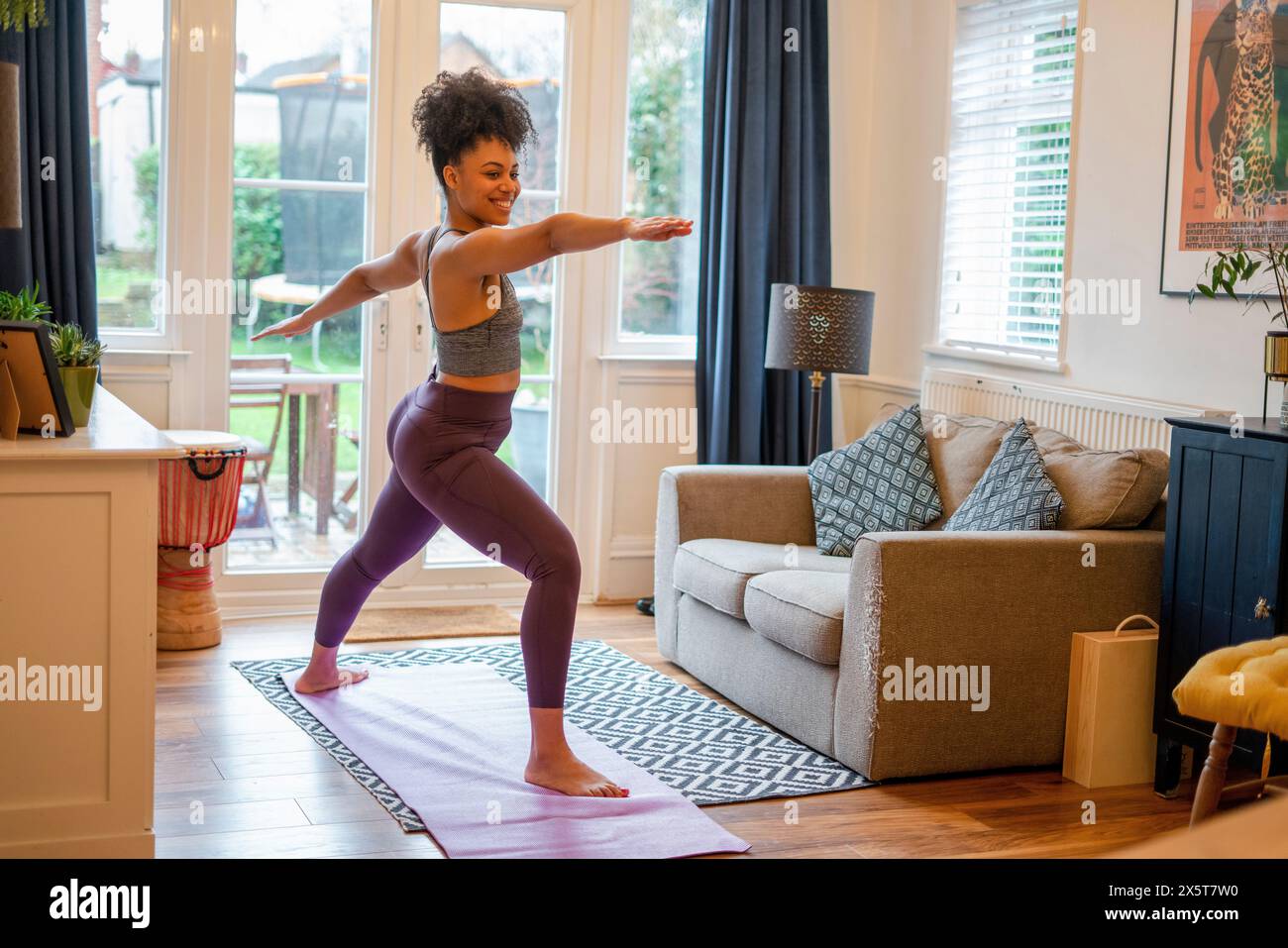 Woman training doing yoga hi-res stock photography and images - Alamy