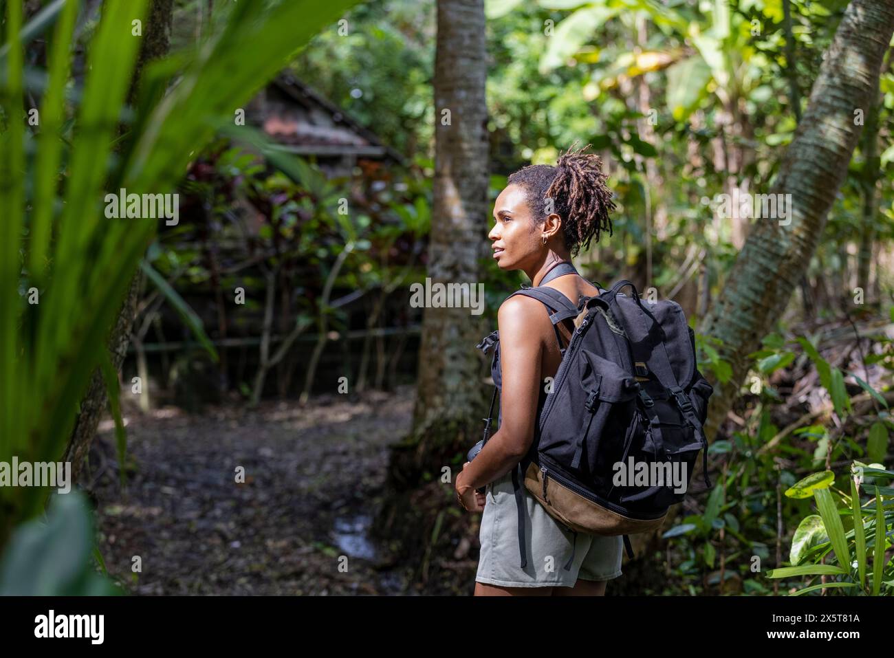Indonesia, Bali, Female tourist hiking in rainforest Stock Photo - Alamy