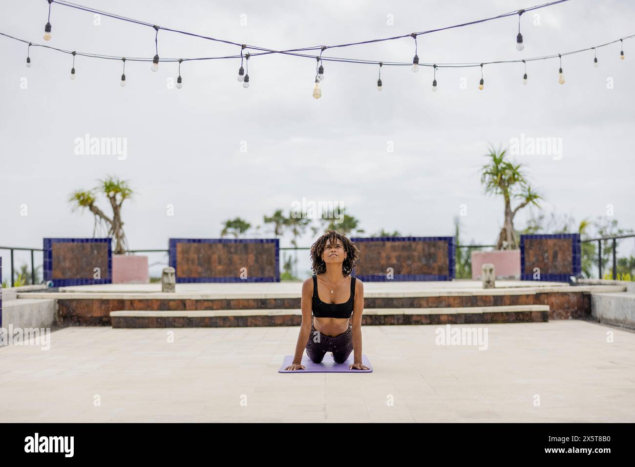 Woman practicing upward facing dog pose Stock Photo - Alamy