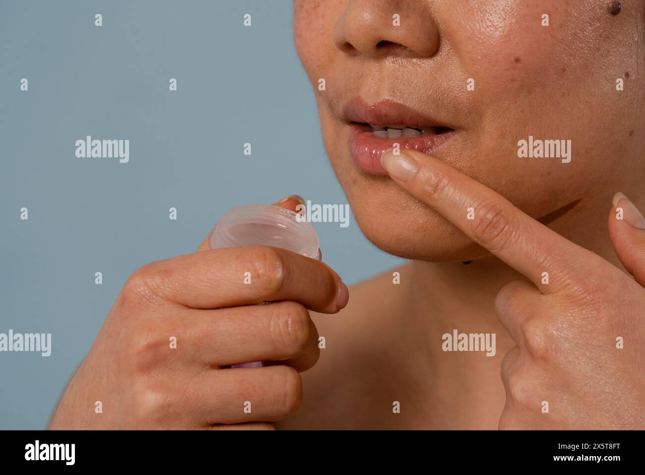 Applying balm hi-res stock photography and images - Alamy