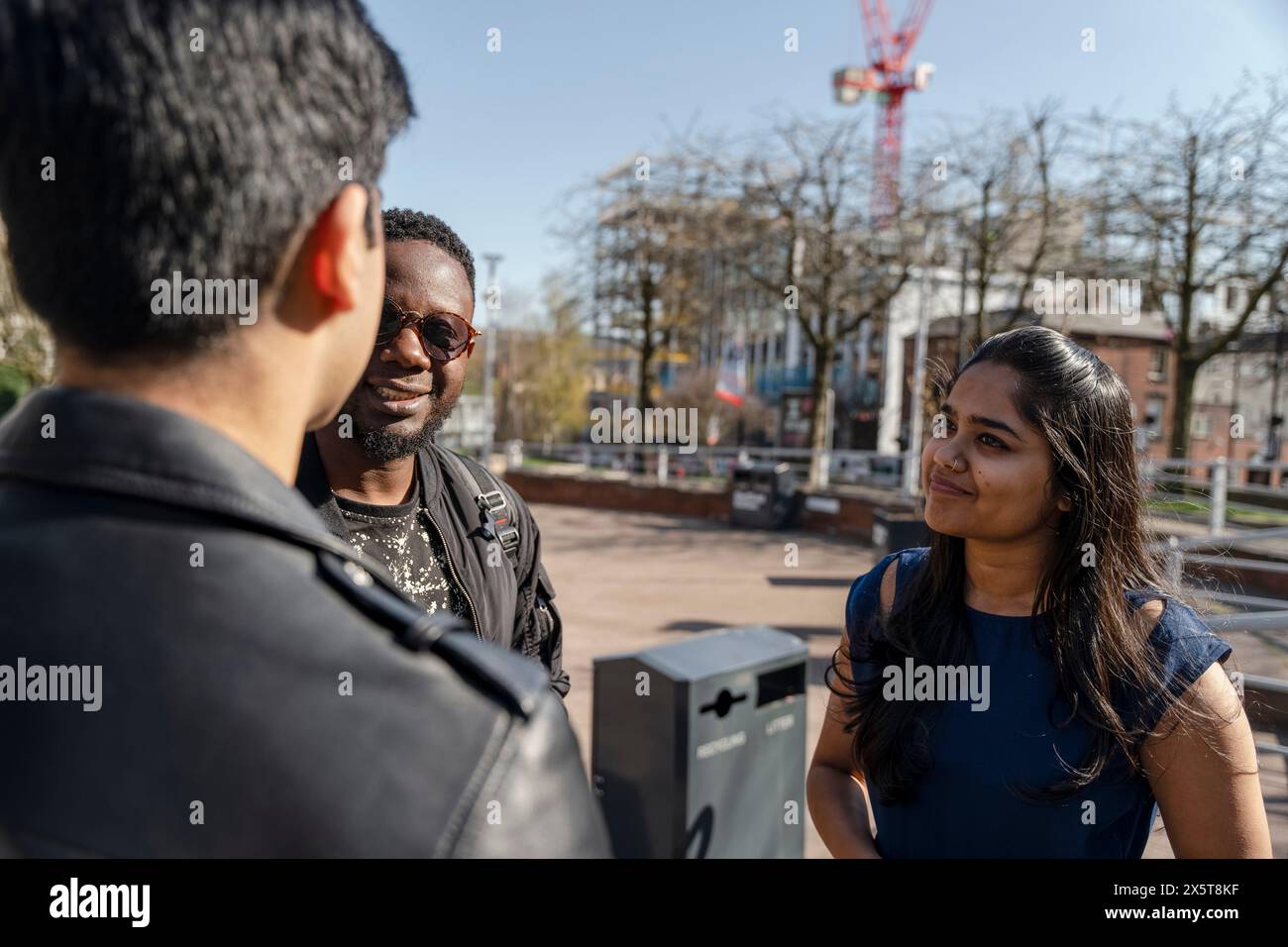 Group of student friends talking on campus Stock Photo - Alamy
