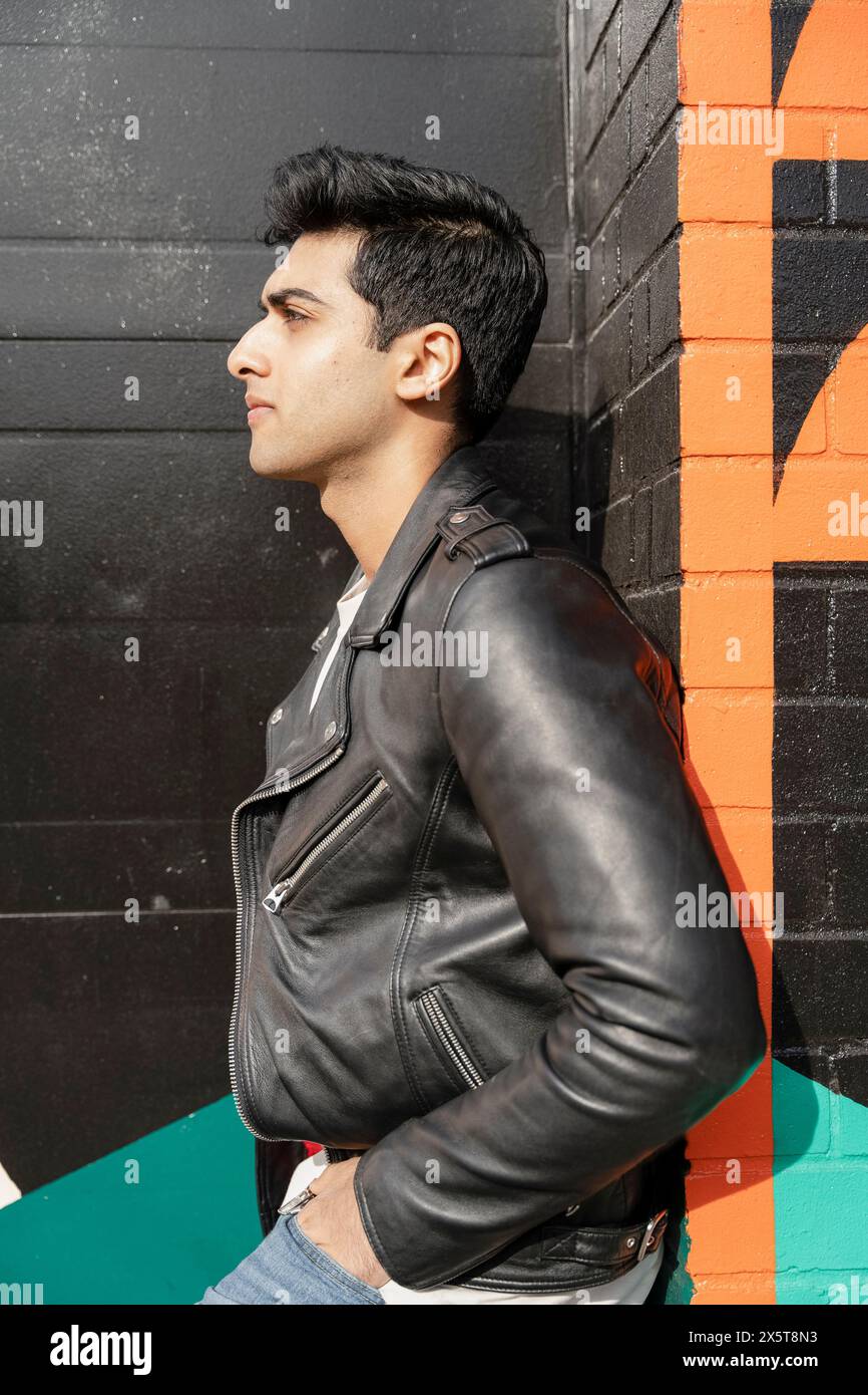 Man side view leather jacket hi-res stock photography and images - Alamy