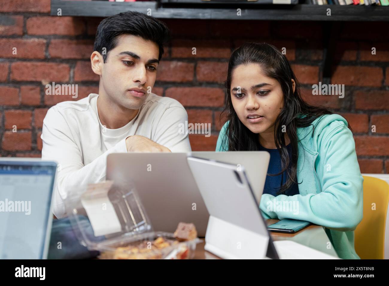 Young students studying in library Stock Photo - Alamy