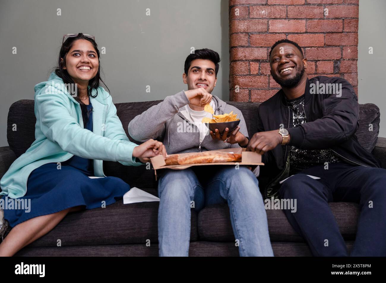 Sharing snacks friends african hi-res stock photography and images - Alamy