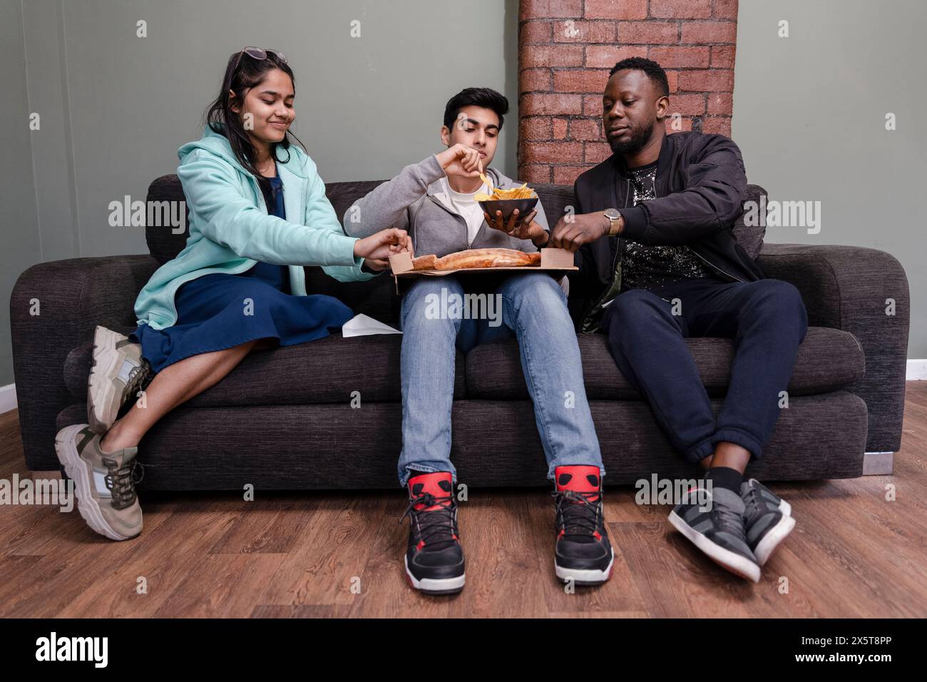 Indian group eating pizza hi-res stock photography and images - Alamy