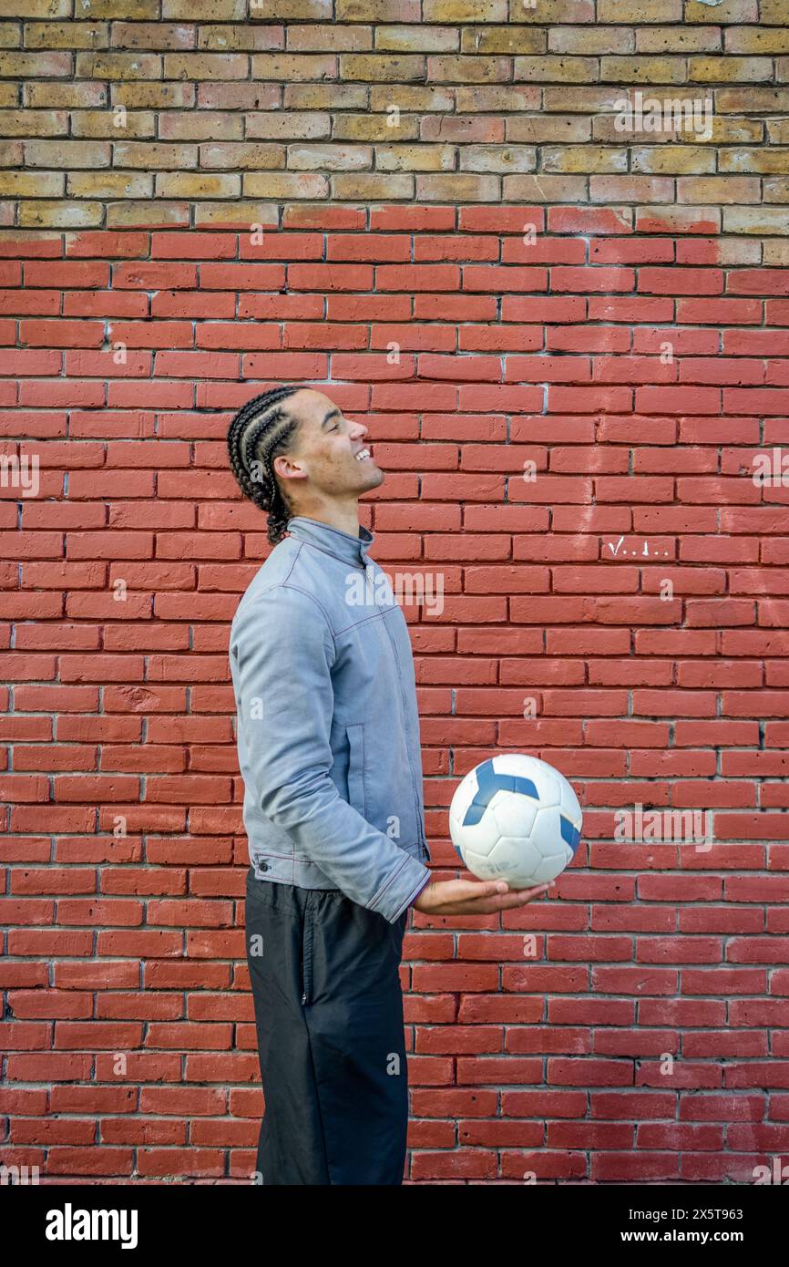 Person holding football uk hi-res stock photography and images - Alamy