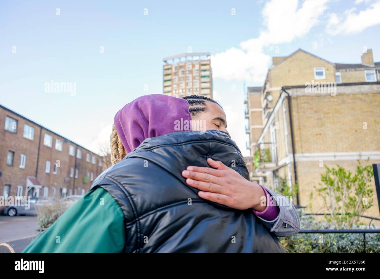 Male friends hugging hi-res stock photography and images - Alamy