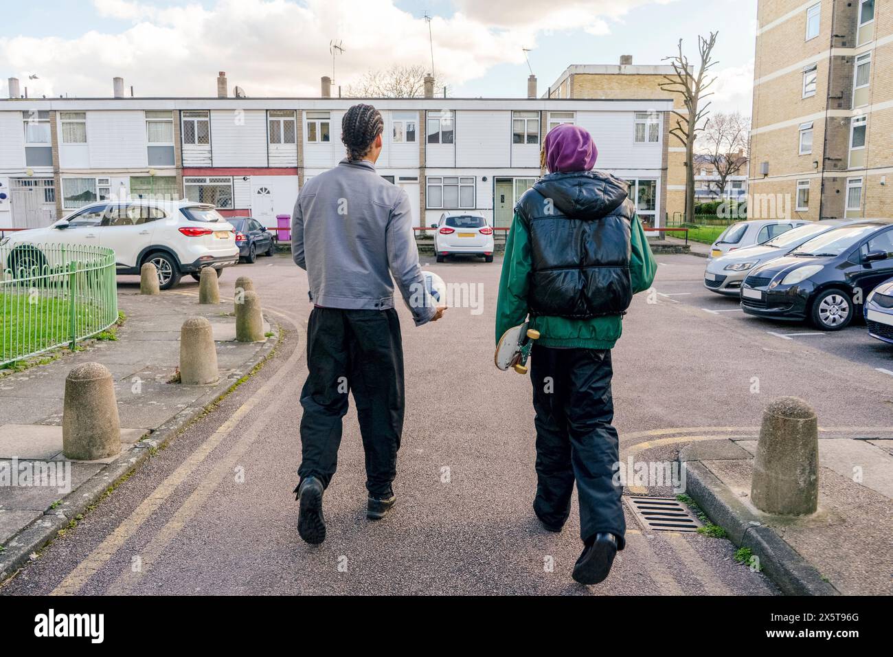 Two male friends walking hi-res stock photography and images - Alamy