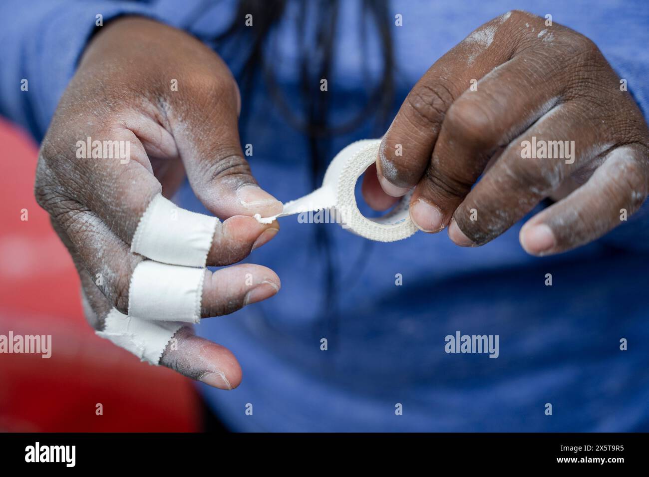 Close-up of woman taping fingers before climbing Stock Photo - Alamy