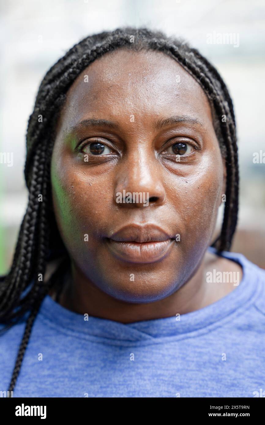 Serious black woman braids hi-res stock photography and images - Alamy