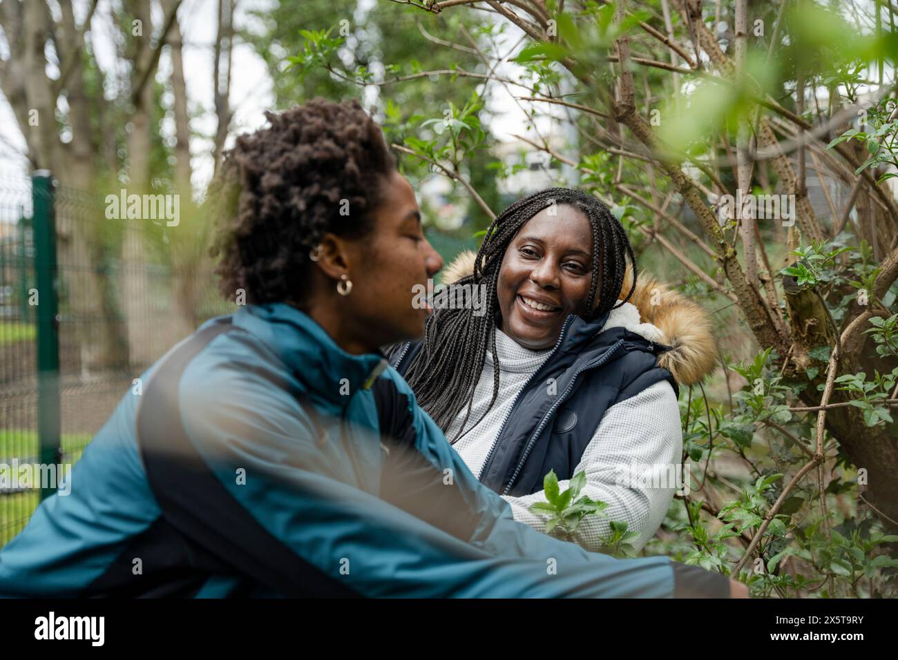 Mother and daughter talking during walk in park Stock Photo - Alamy