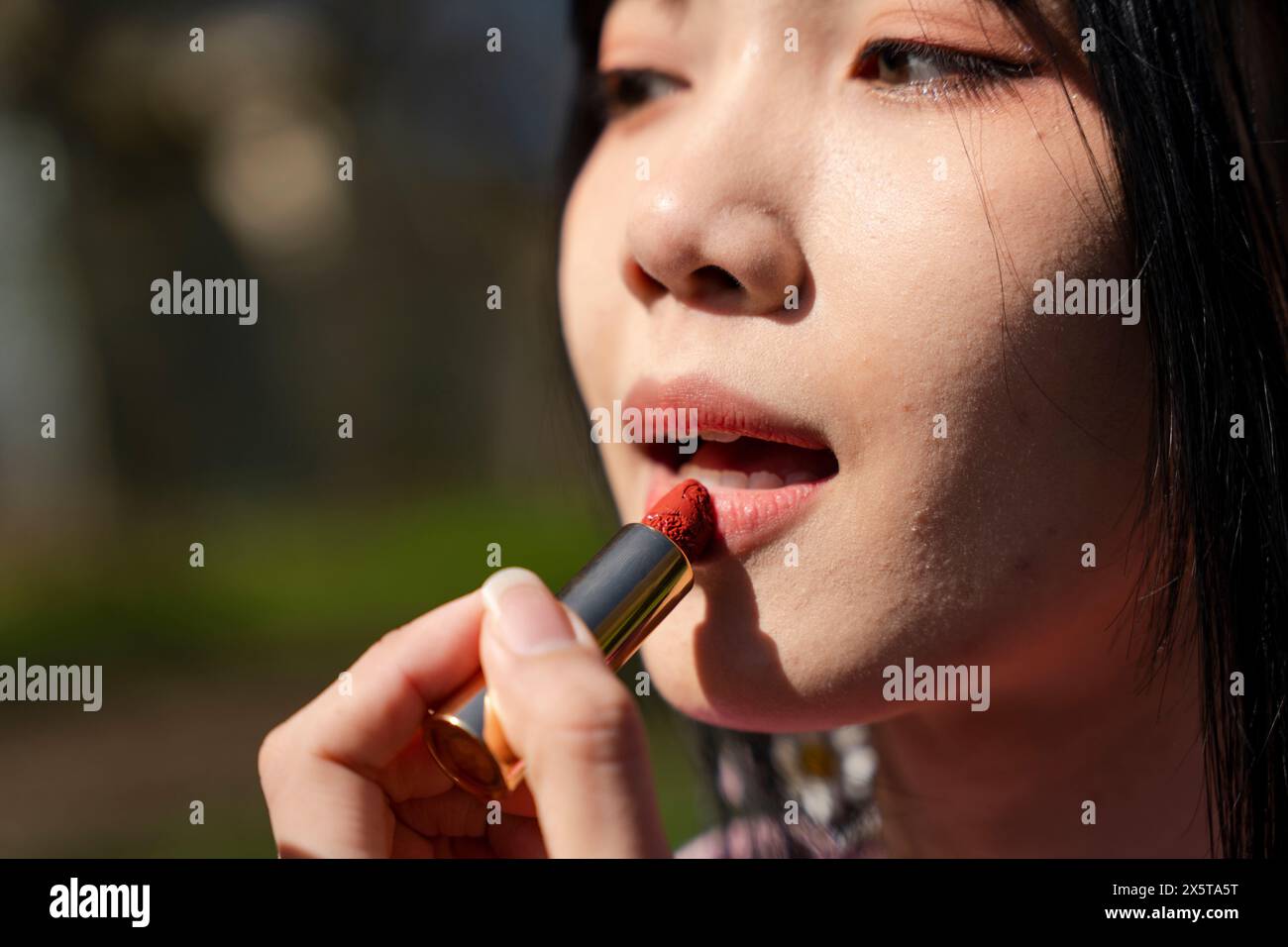 Asian young woman applying hi-res stock photography and images - Alamy