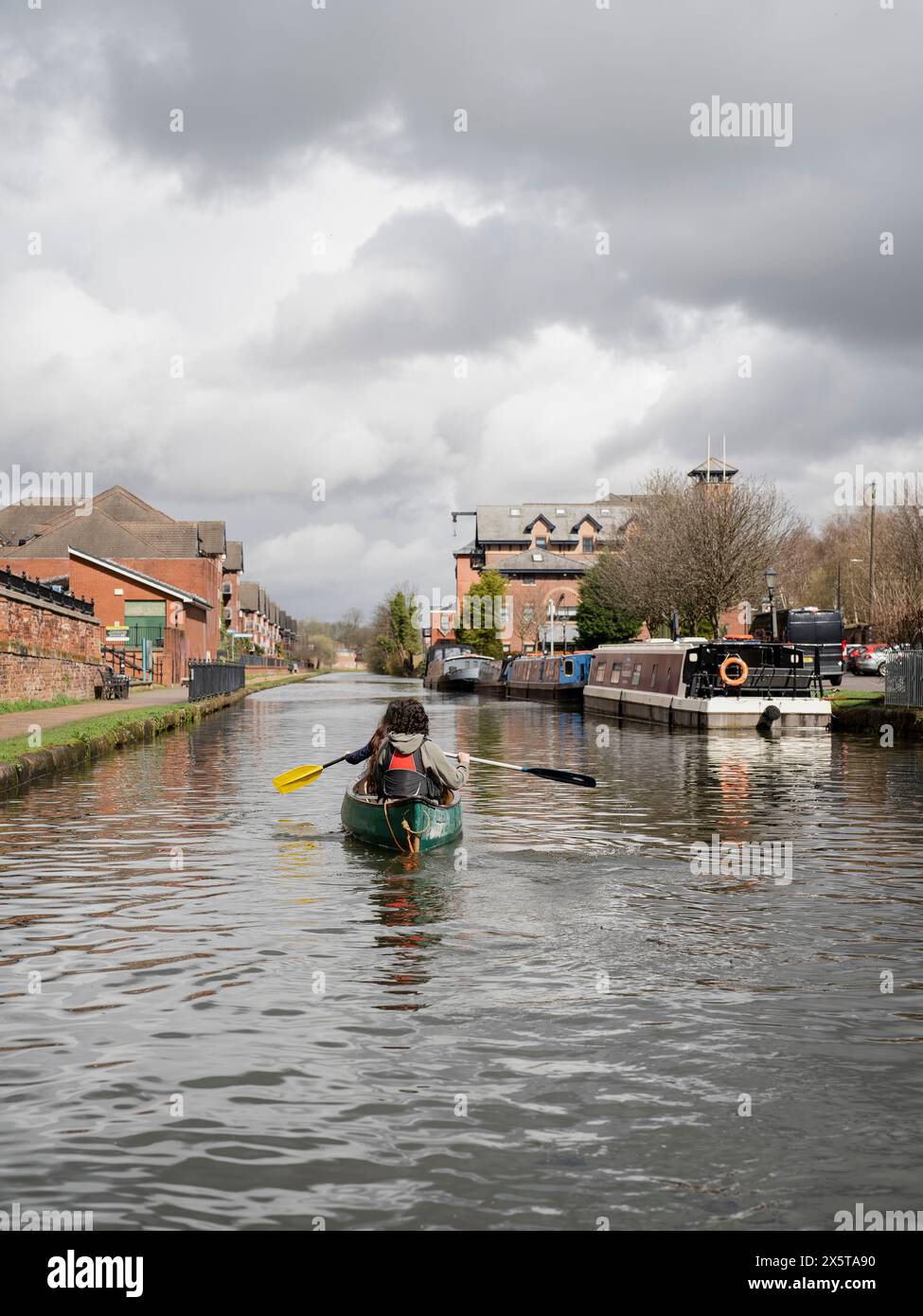Back view of women canoeing in canal Stock Photo - Alamy