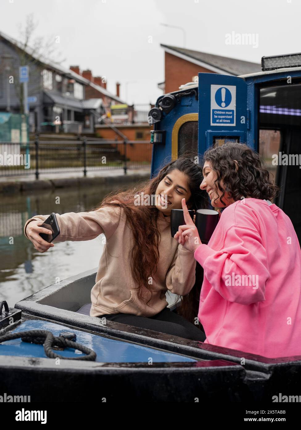 Young friends on boat hi-res stock photography and images - Alamy