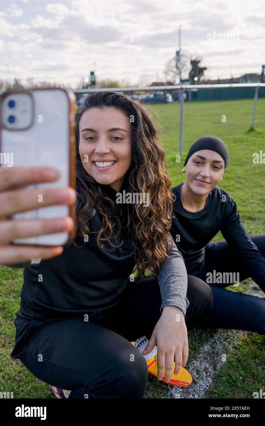Female soccer players taking selfie Stock Photo - Alamy