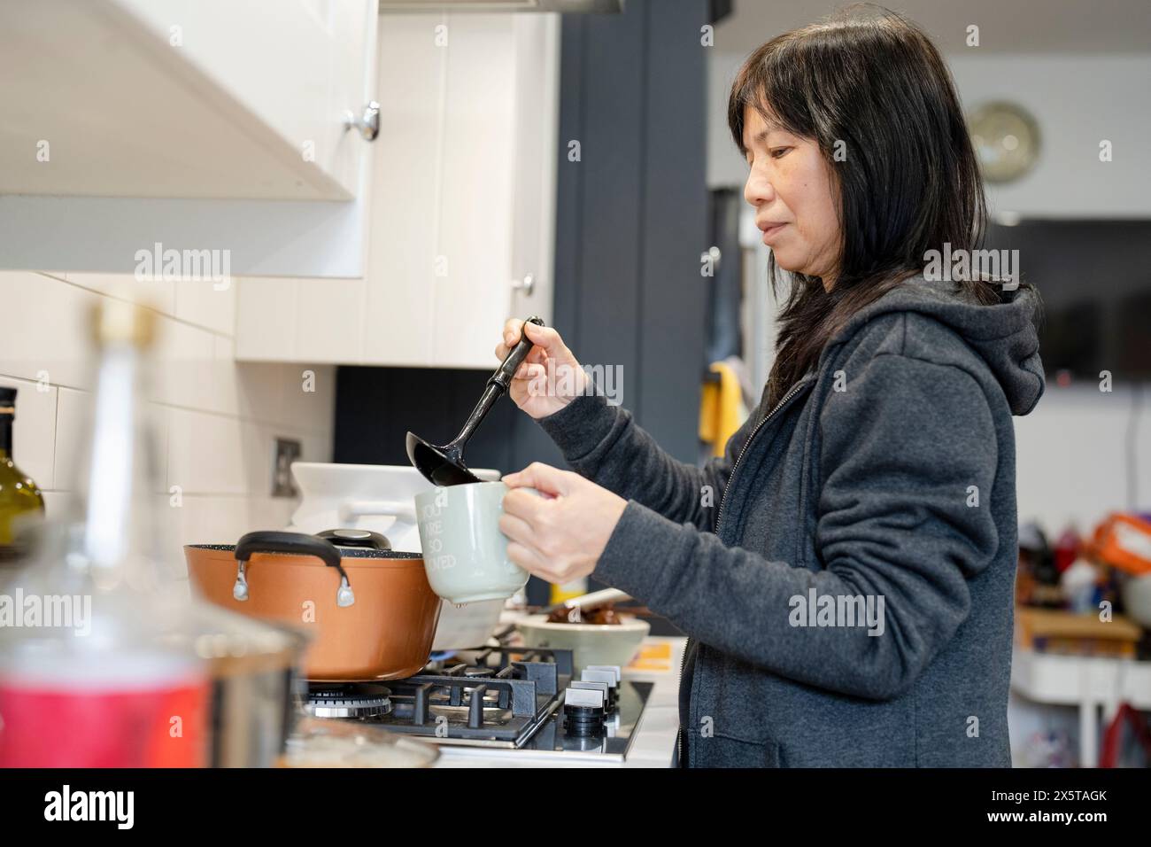 Woman tea stove hi-res stock photography and images - Alamy
