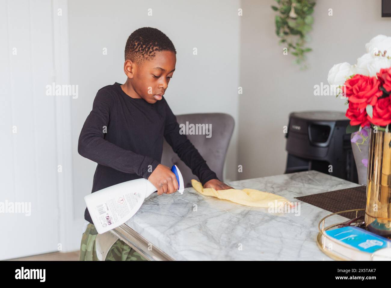 Boy cleaning table hi-res stock photography and images - Alamy