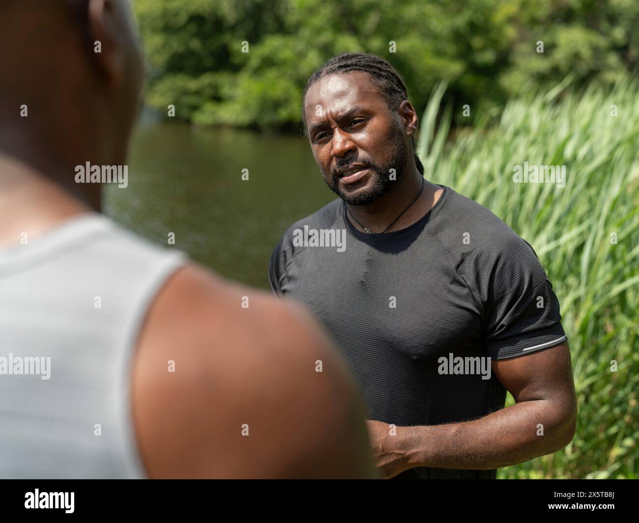 Two men talking hi-res stock photography and images - Alamy