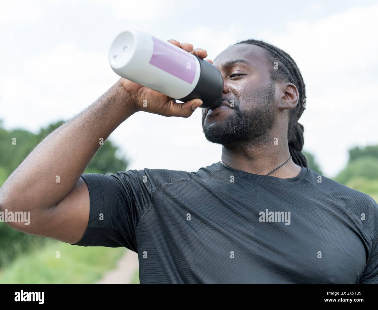 Drinking man bottle hi-res stock photography and images - Alamy