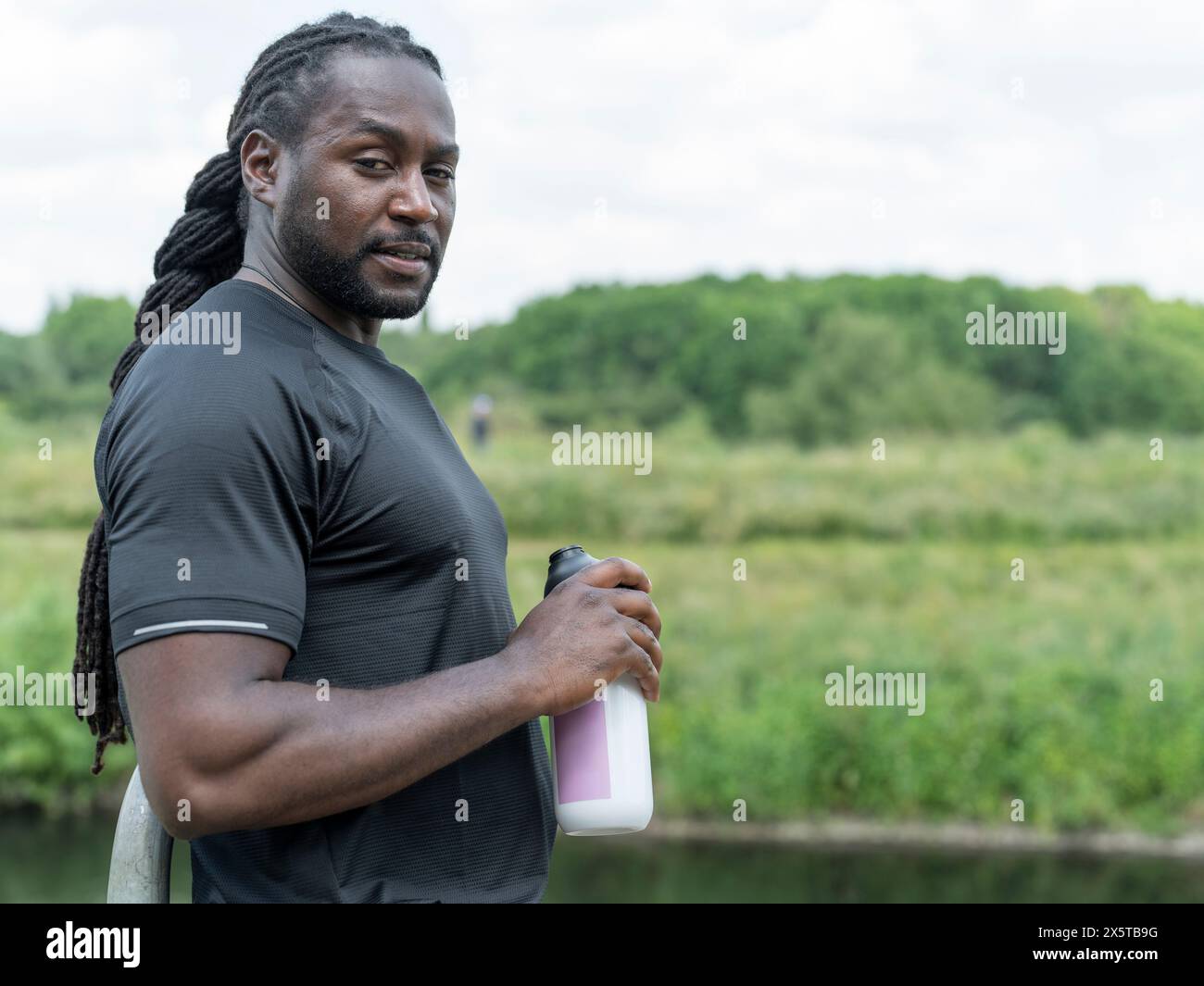 African man bottle of water hi-res stock photography and images - Alamy